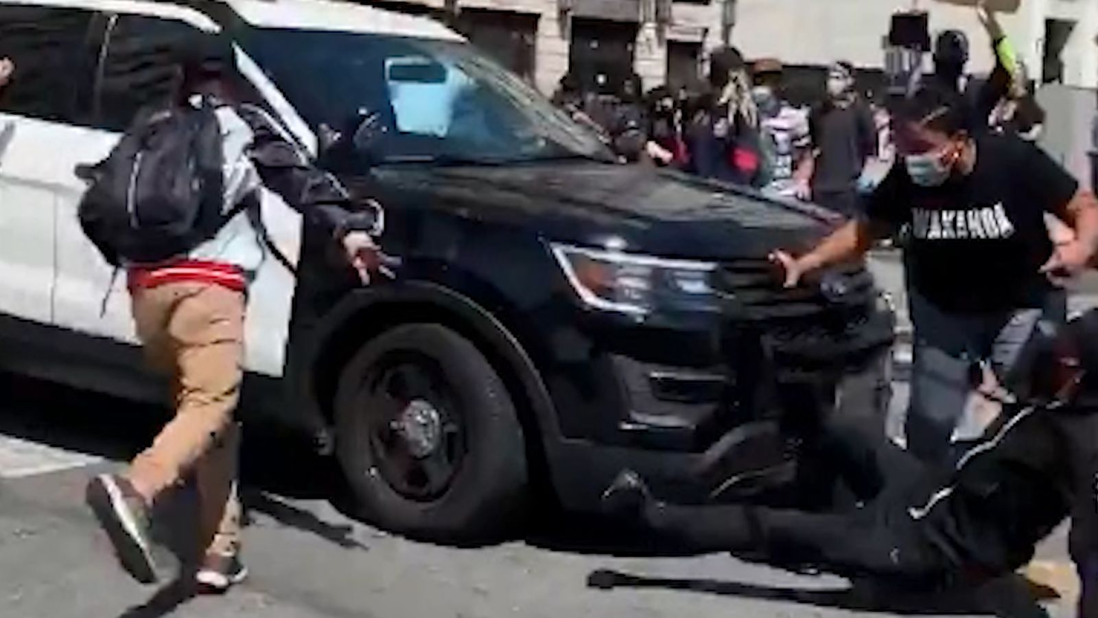 George Floyd protests: LAPD vehicle drives away after knocking ...