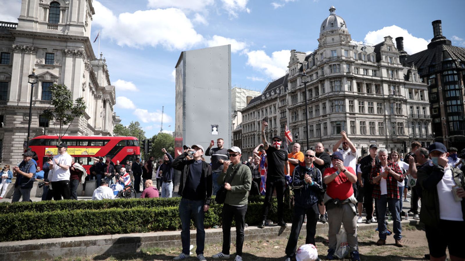 Crowds gather at boarded-up statue of Winston Churchill in London | UK ...