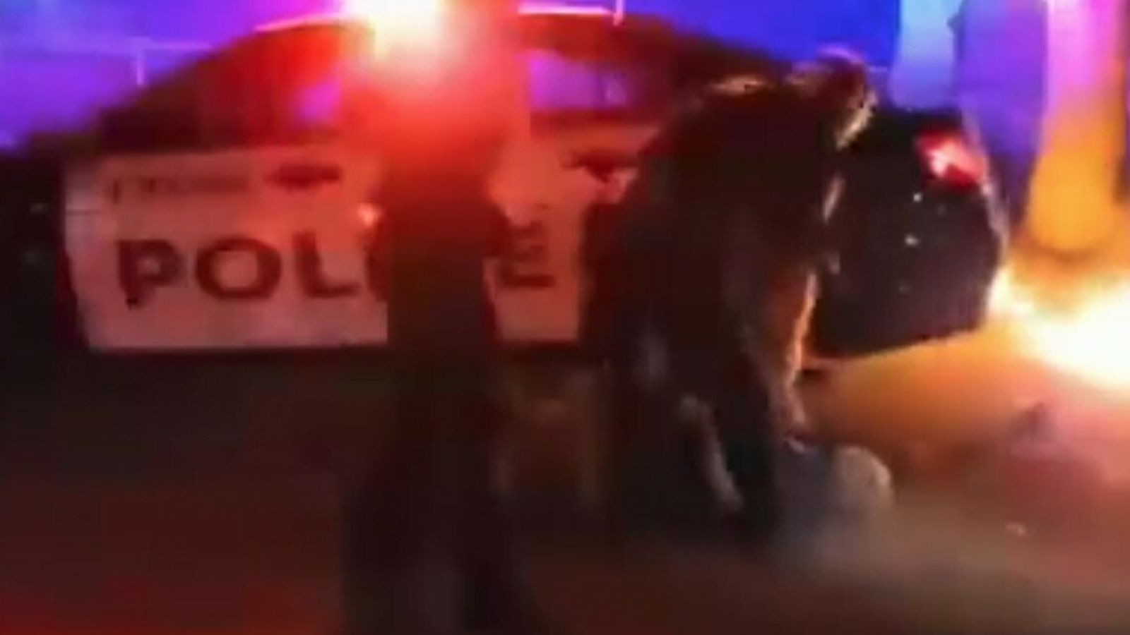 Protesters applaud after officer knocked out by brick | US News | Sky News