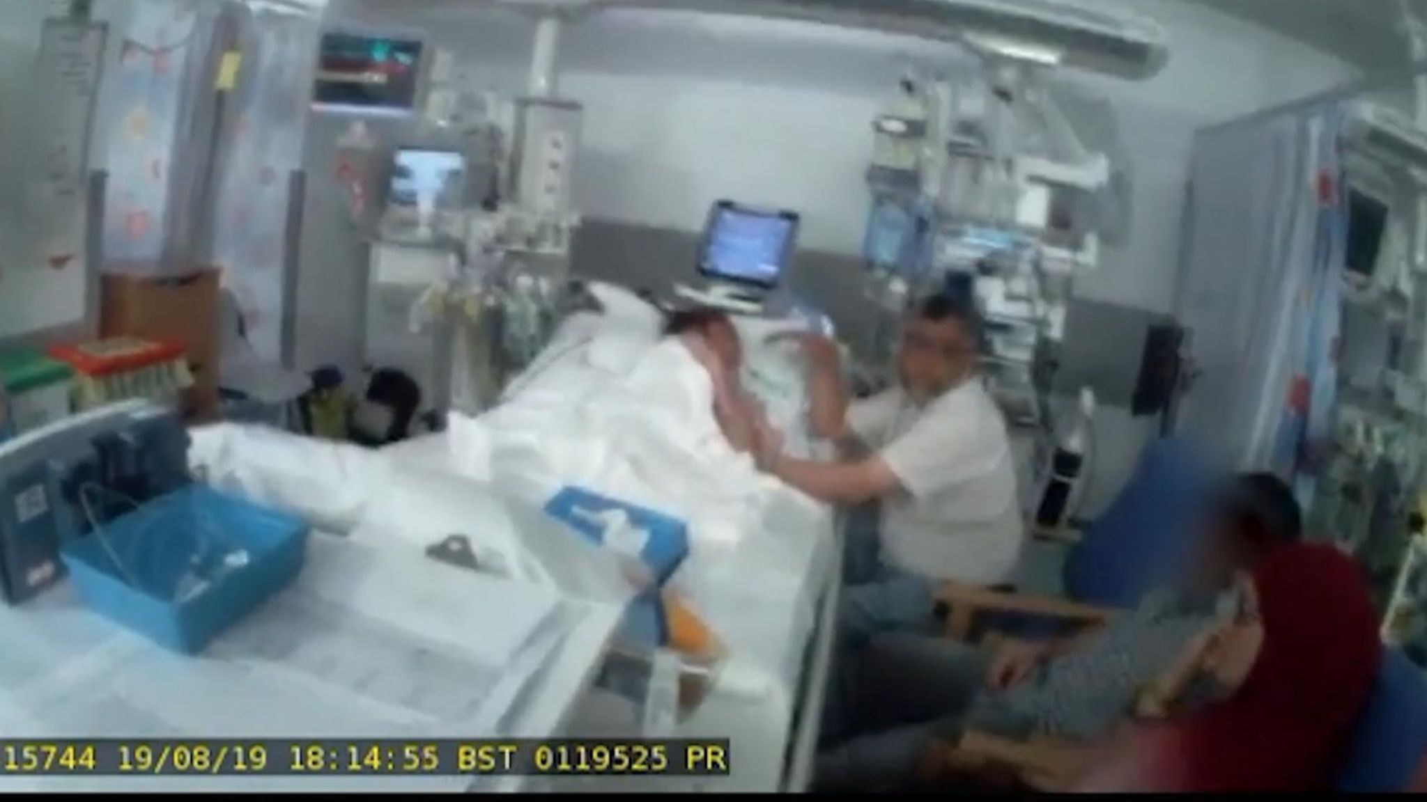 Father who was dragged away from dying child's bedside takes legal ...