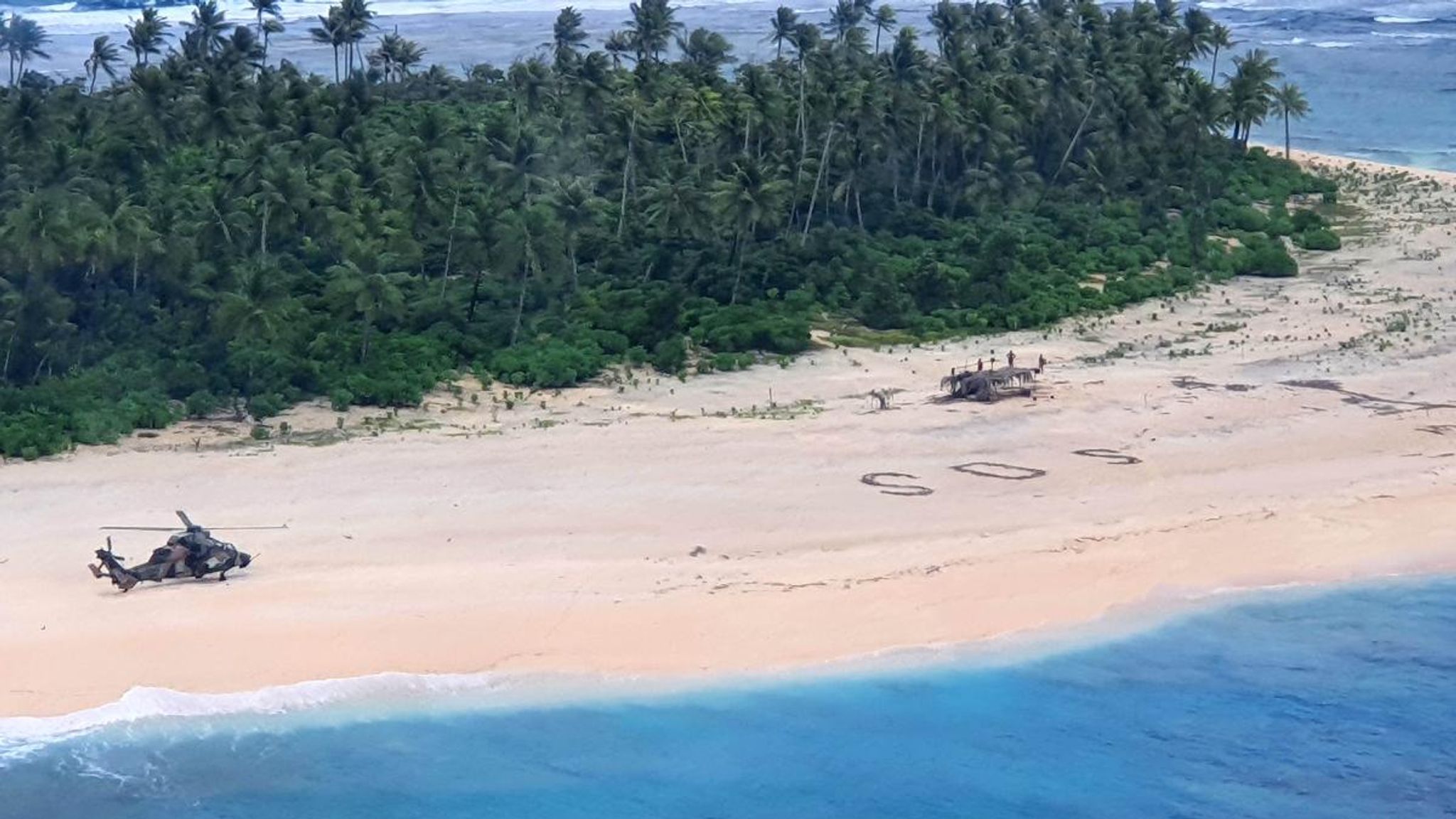 'SOS' message in sand saves three men stranded on deserted Pacific ...