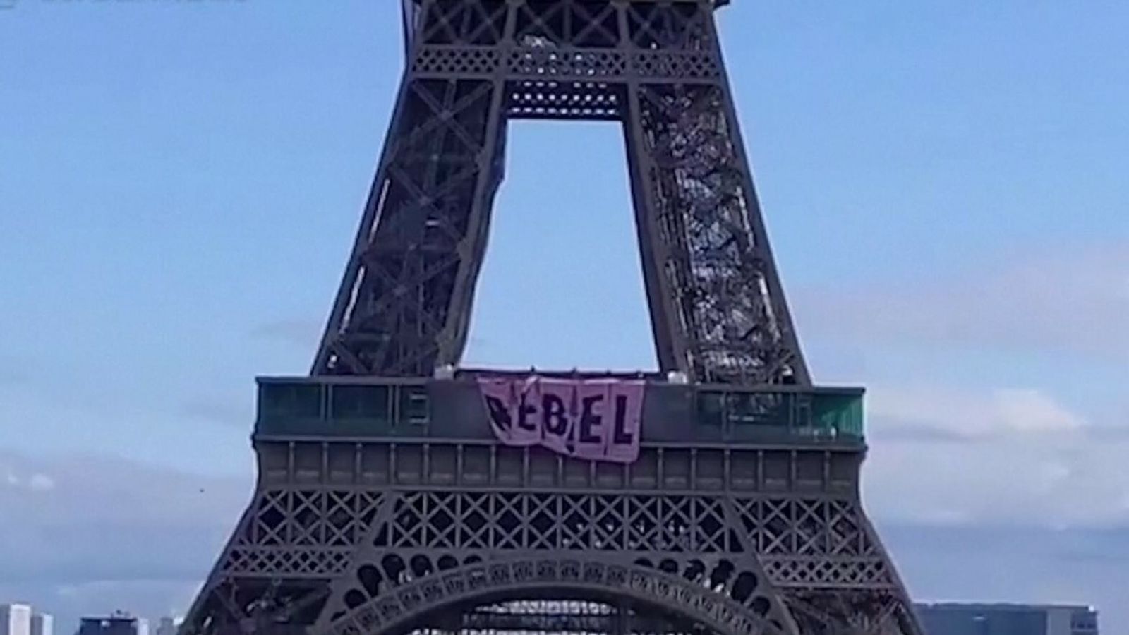 Paris: Extinction Rebellion protesters unfurl banner over Eiffel tower ...