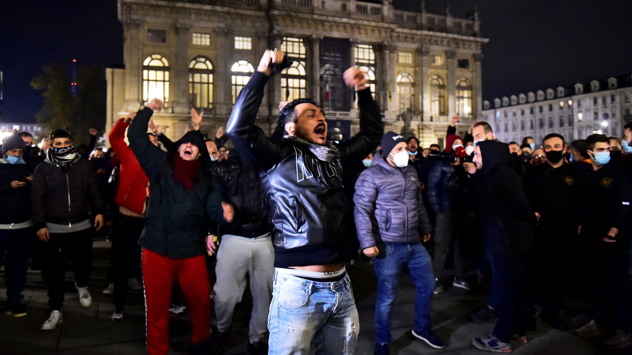 Coronavirus: Lockdown protesters in Italy throw bottles and smoke bombs ...