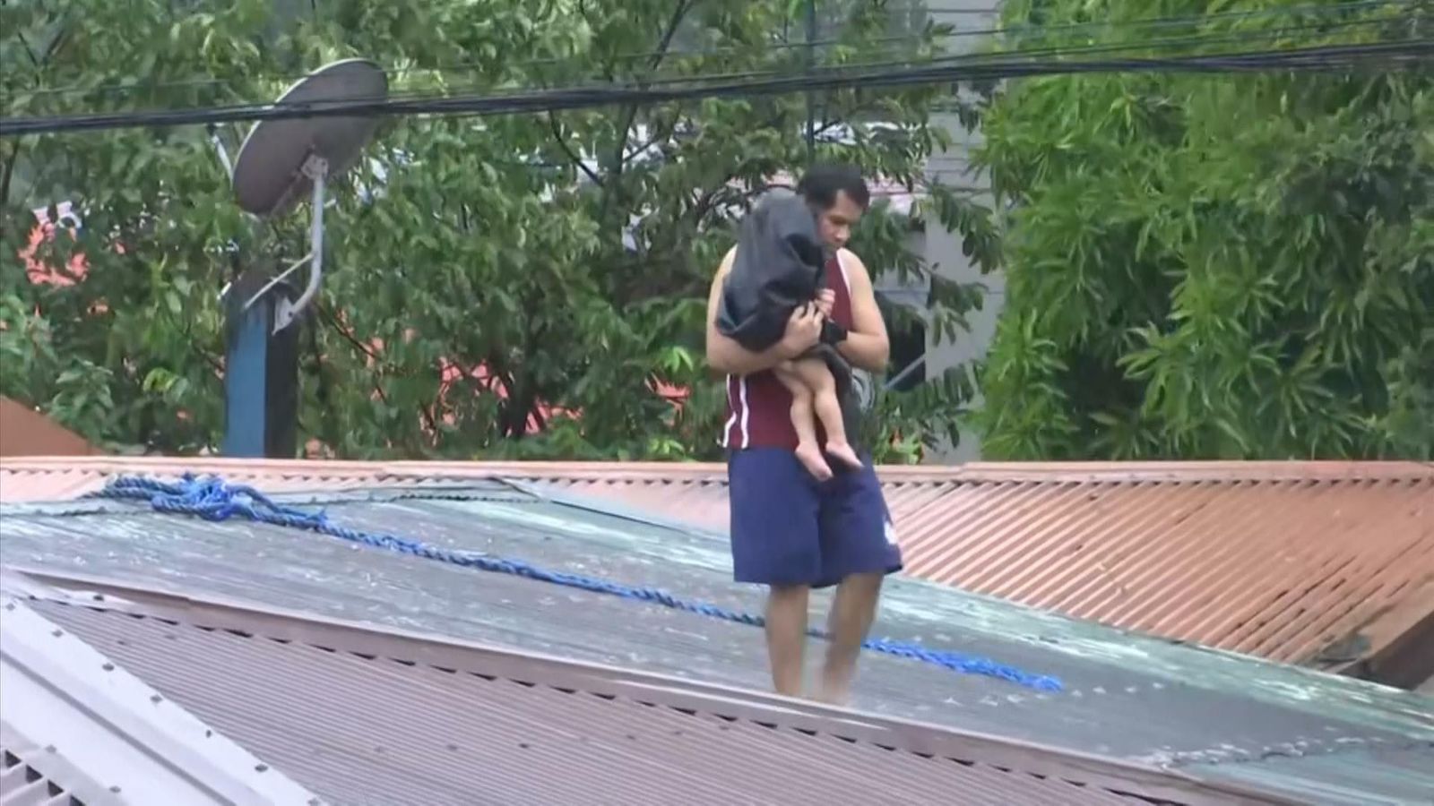 Philippines: Children rescued from rooftops after typhoon | World News ...