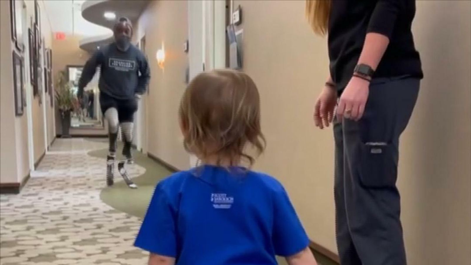 Double amputee champion encourages boy with prosthetics | World News ...