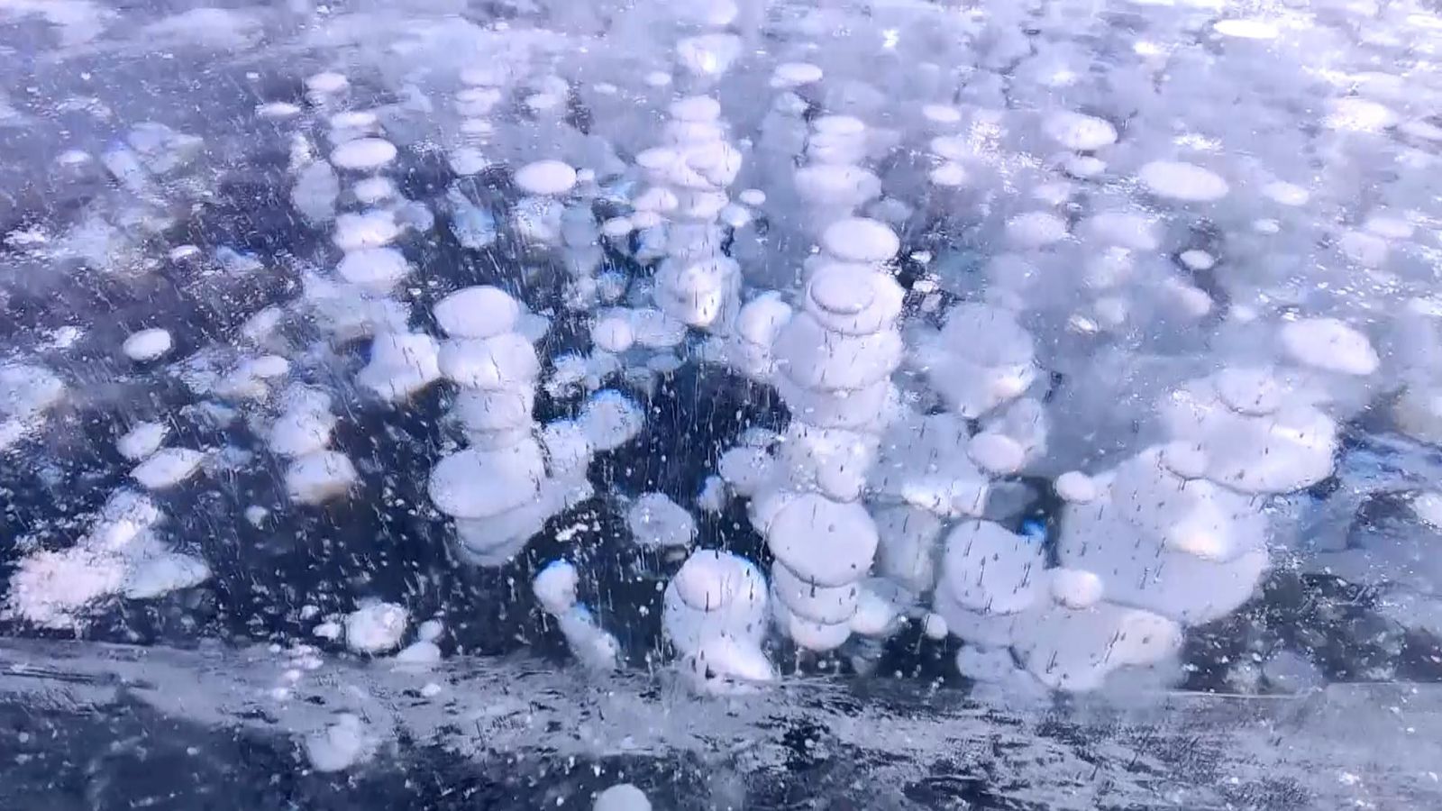 Ice bubbles form in frozen Chinese lake | World News | Sky News