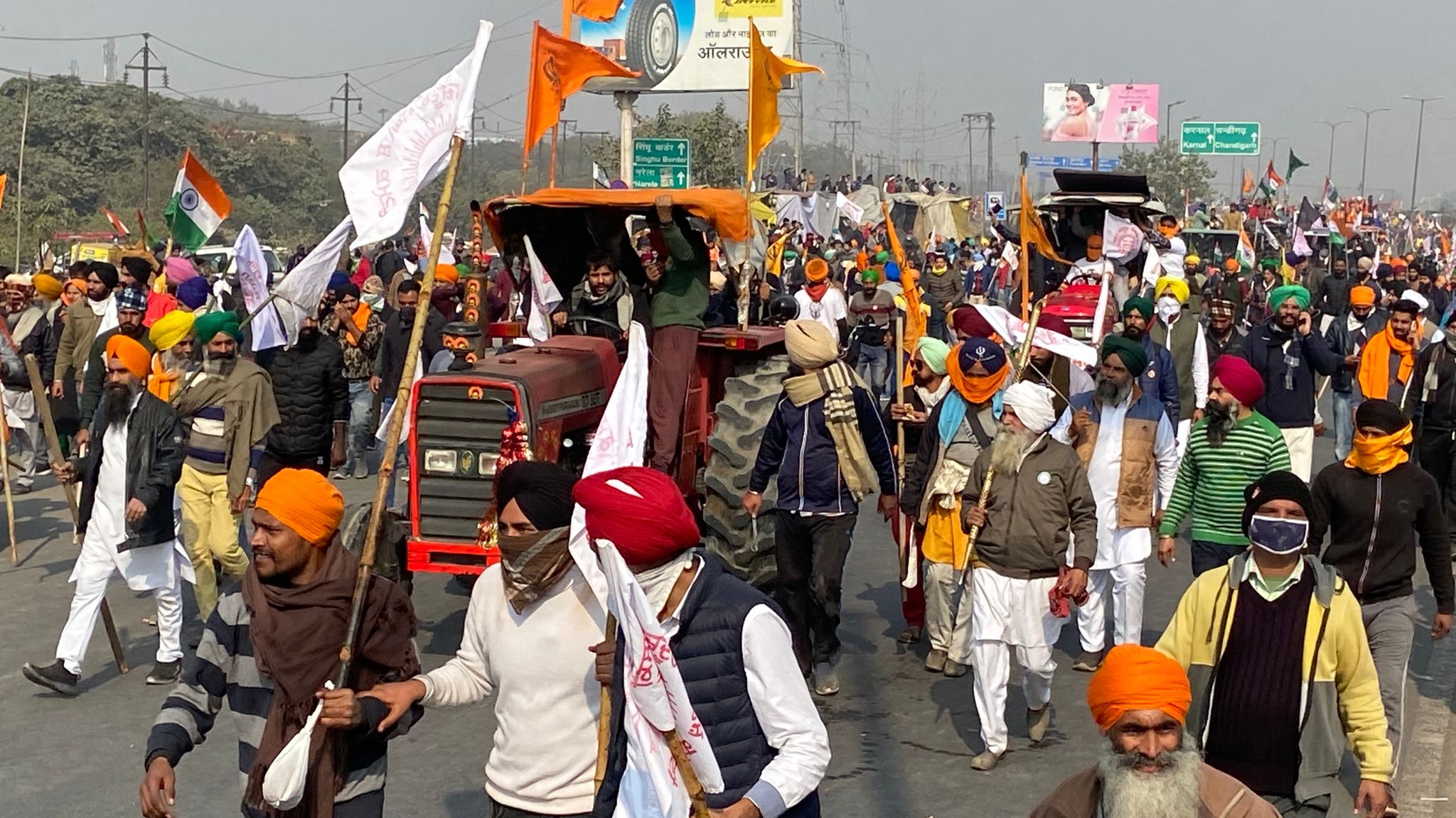 India protests: Police block roads into New Delhi to stop farmers ...