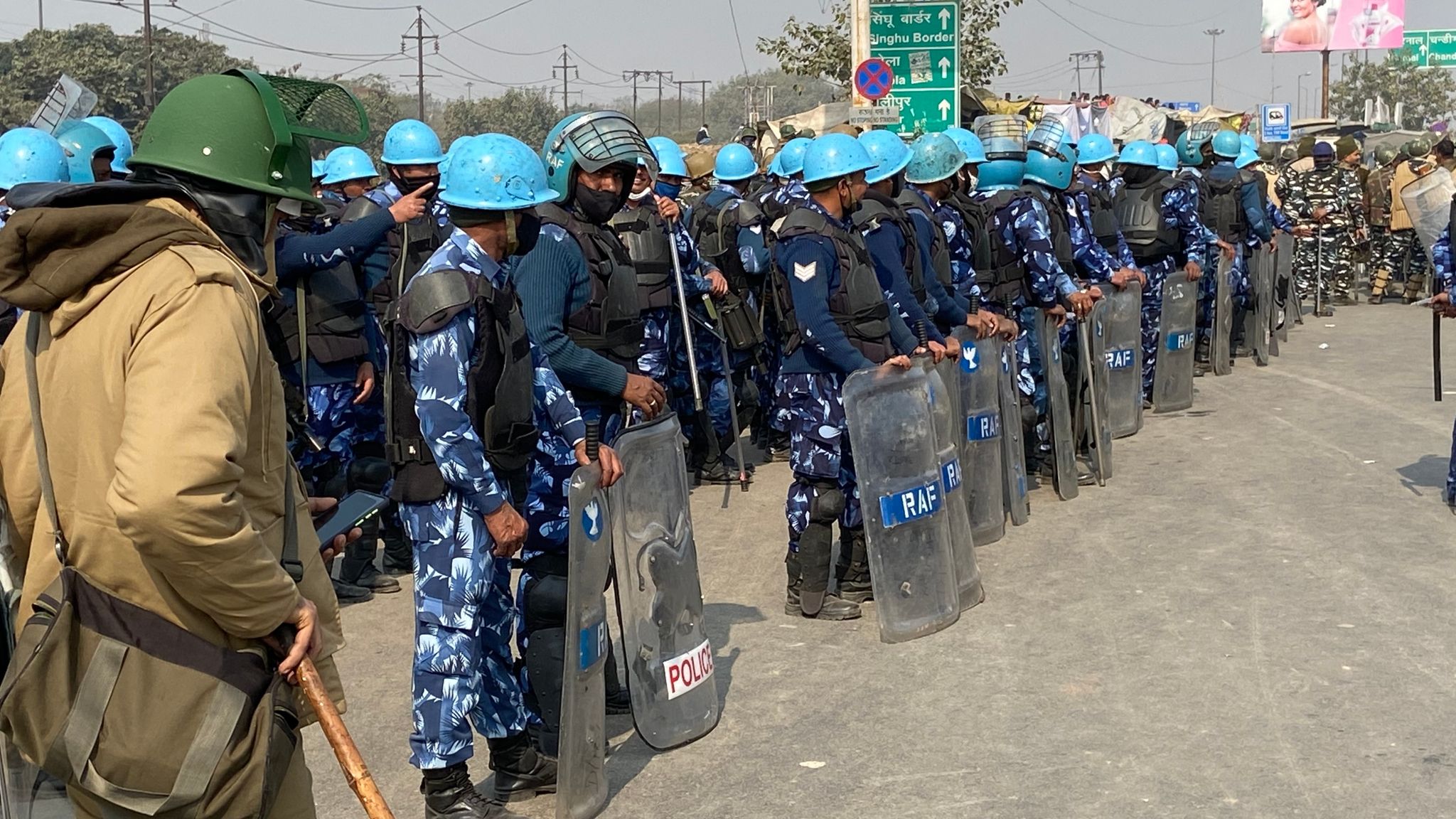 India protests: Farmers armed with sticks and spears clash with police ...