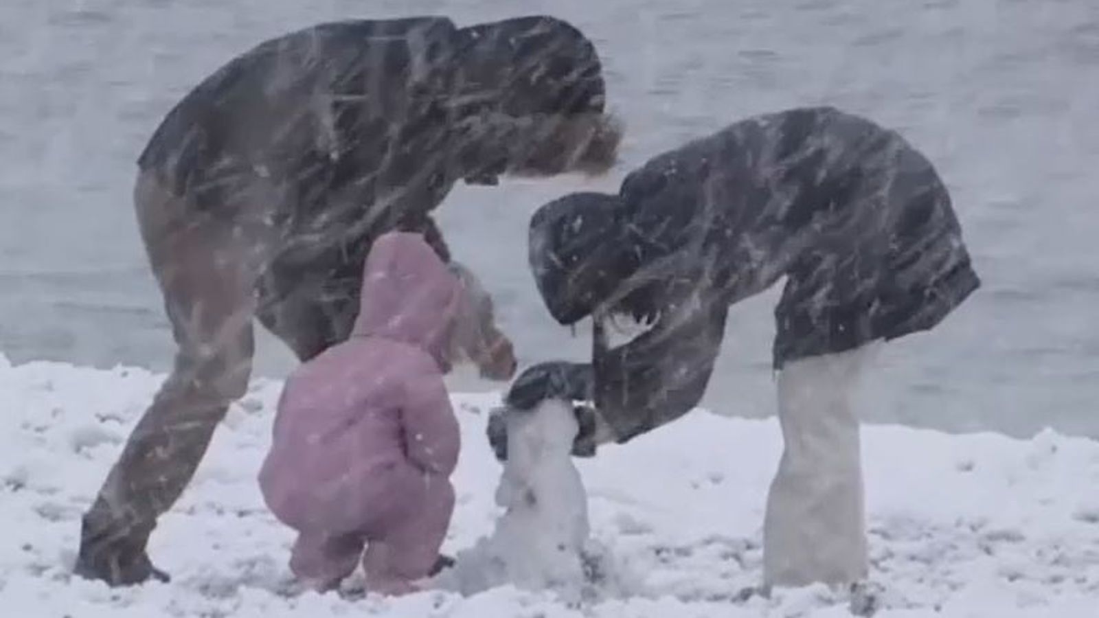 Building snowmen on Athens beach | World News | Sky News