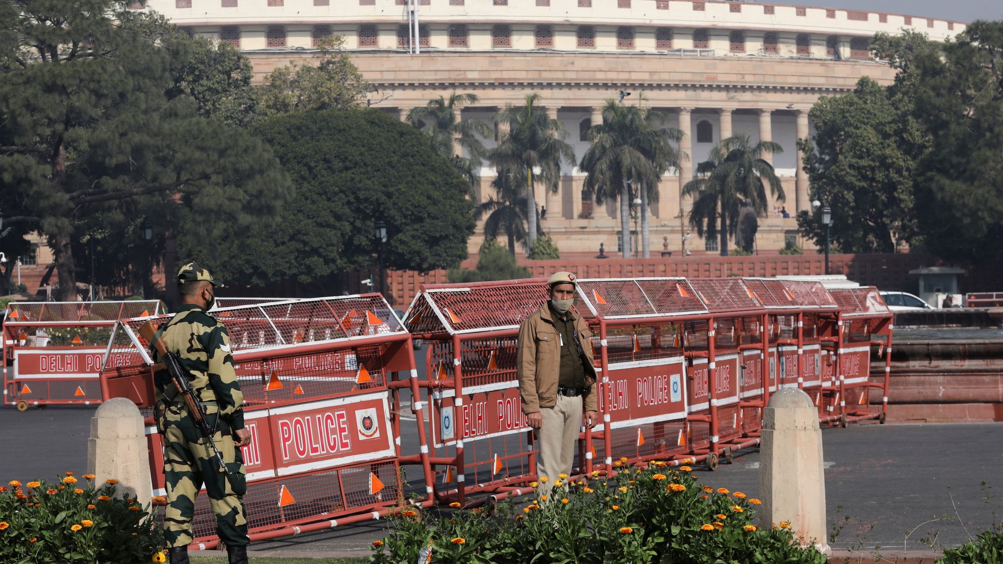 India protests: Police block roads into New Delhi to stop farmers ...