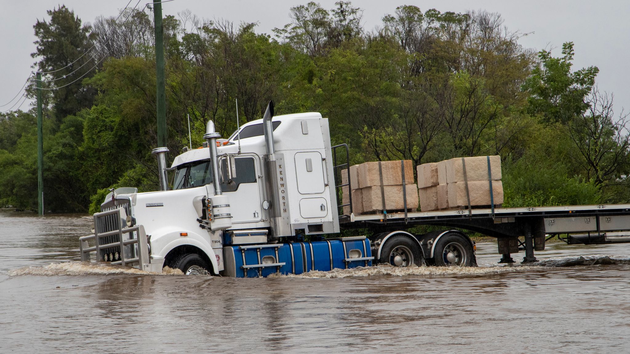 Australia flash floods: 18,000 evacuated and hundreds rescued as ...
