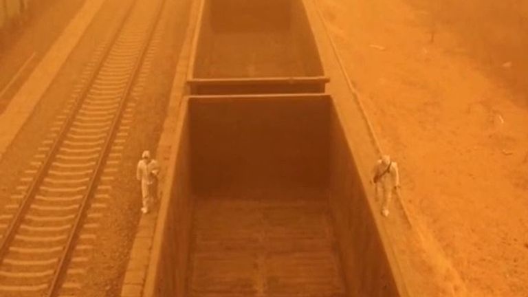 China: Beijing sandstorm turns air an eerie orange | Sky News