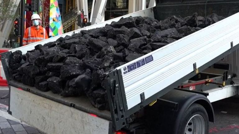 Extinction Rebellion: Fake coal dumped outside Lloyd's of London ...