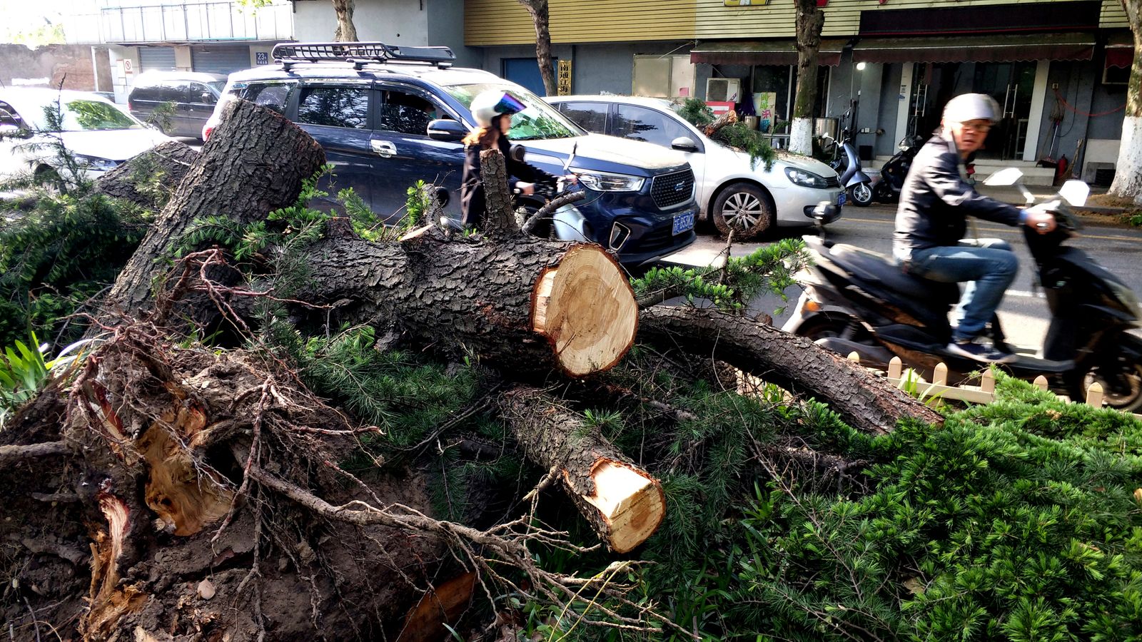 China storm: Eleven dead and thousands evacuated after massive ...