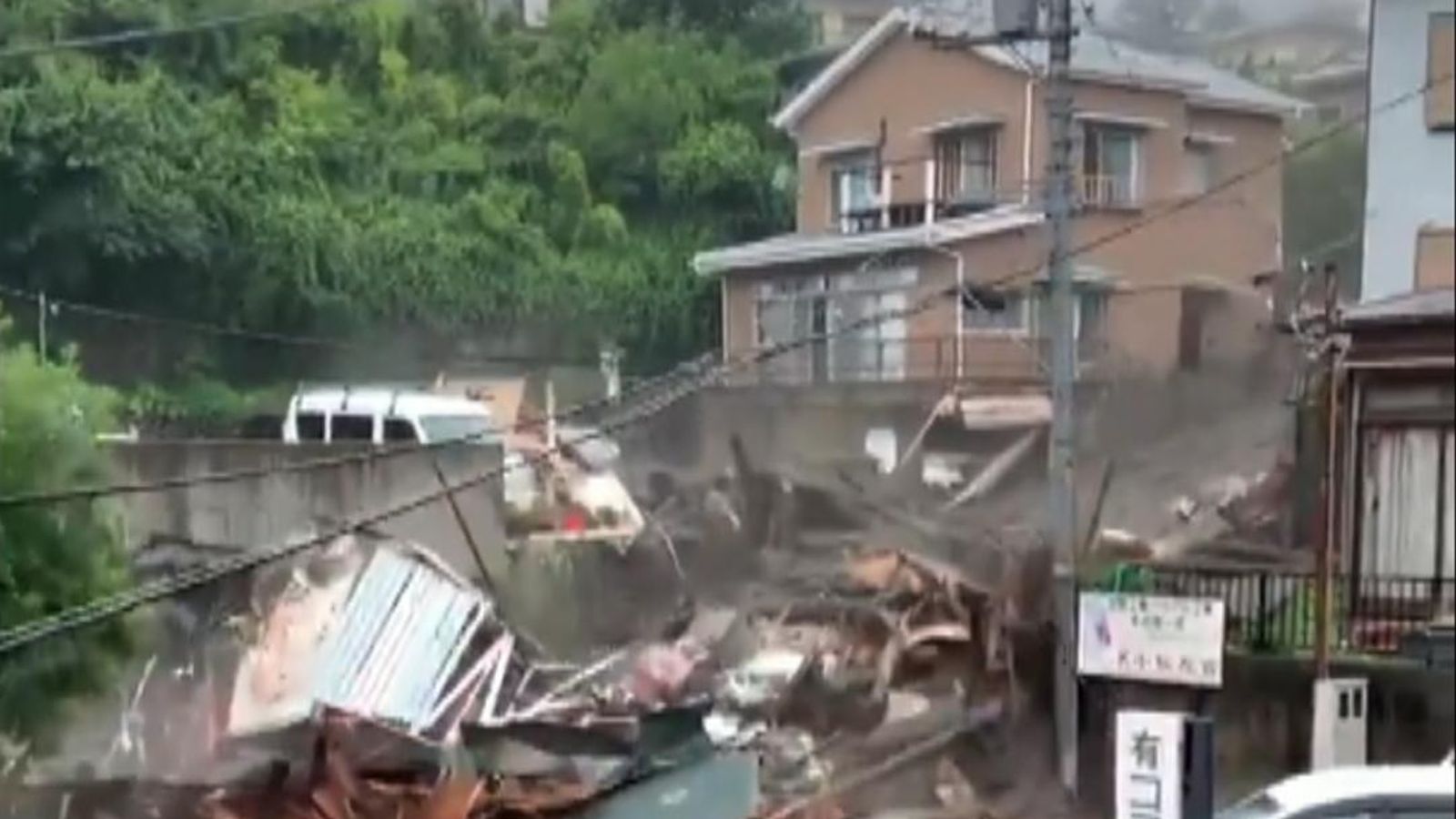 Japan: Car drives away before torrent of mud hits | World News | Sky News