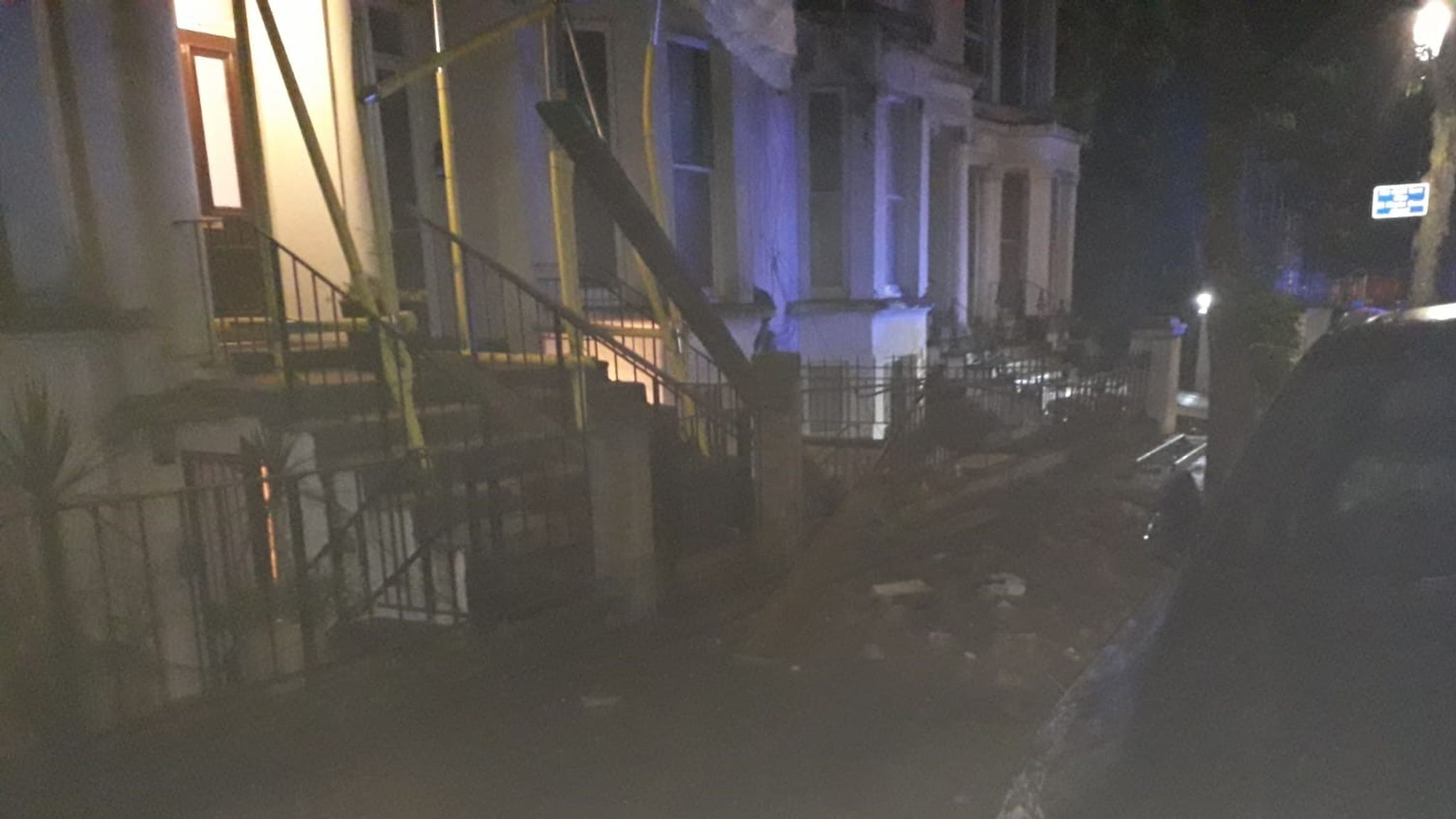 Thirteen people rescued after roof collapse trapped them inside flats ...