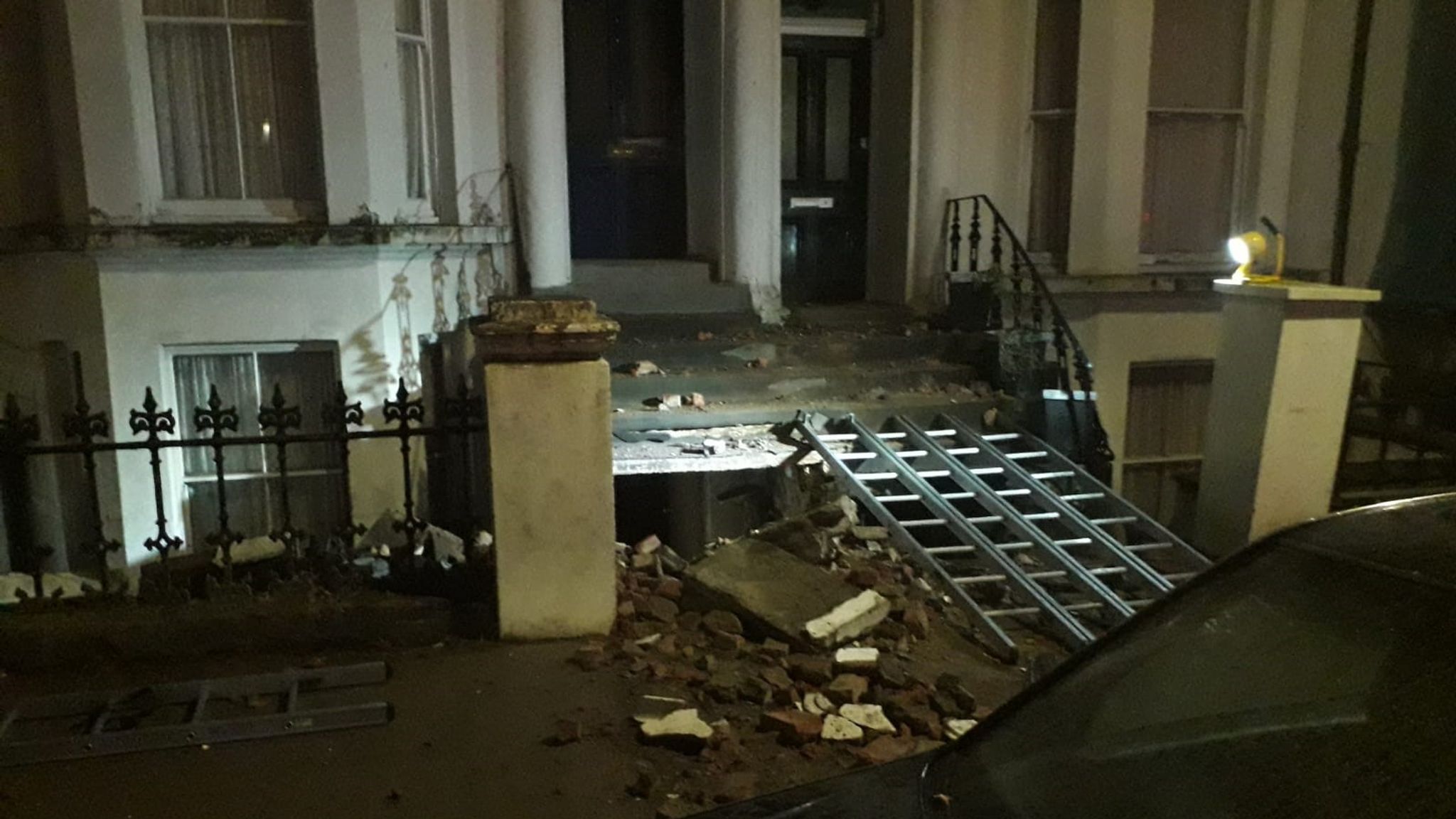 Thirteen people rescued after roof collapse trapped them inside flats ...