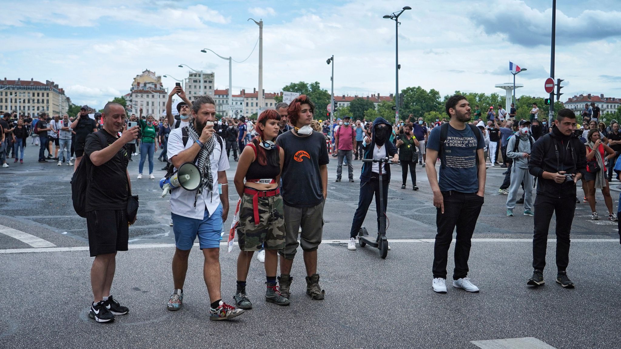 COVID-19: Tear gas fired amid clashes at coronavirus vaccine passport ...