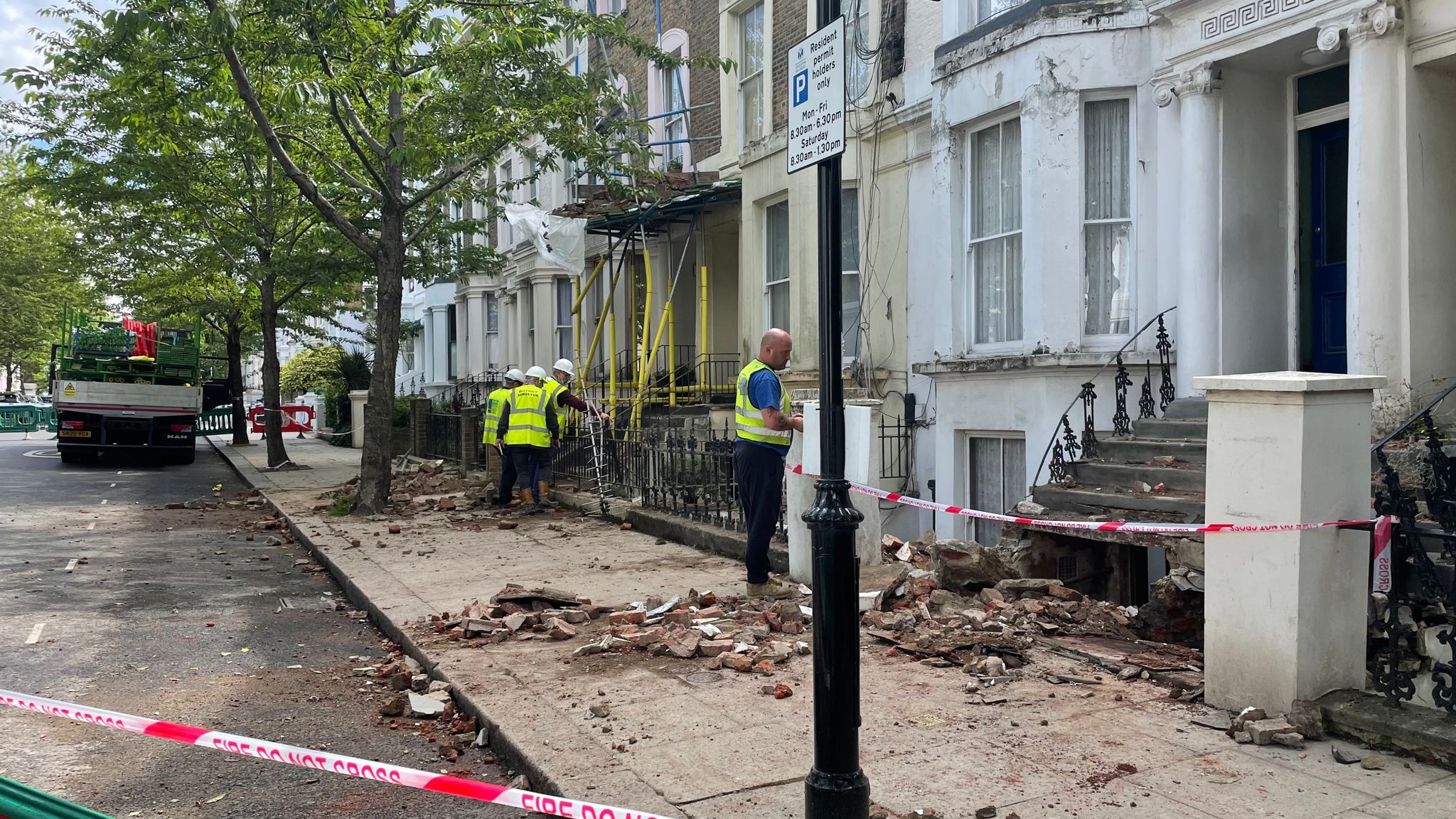 Thirteen people rescued after roof collapse trapped them inside flats ...