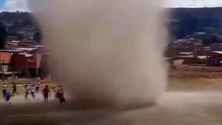 Dust devil whirlwind disrupts football match in Bolivia | World News ...
