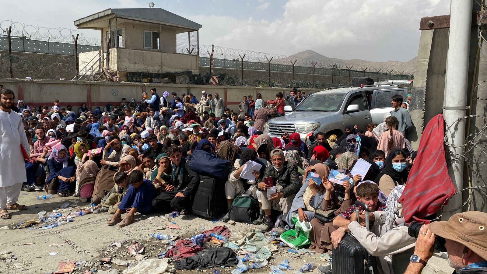 Desperation, as thousands queue next to Kabul airport | World News ...
