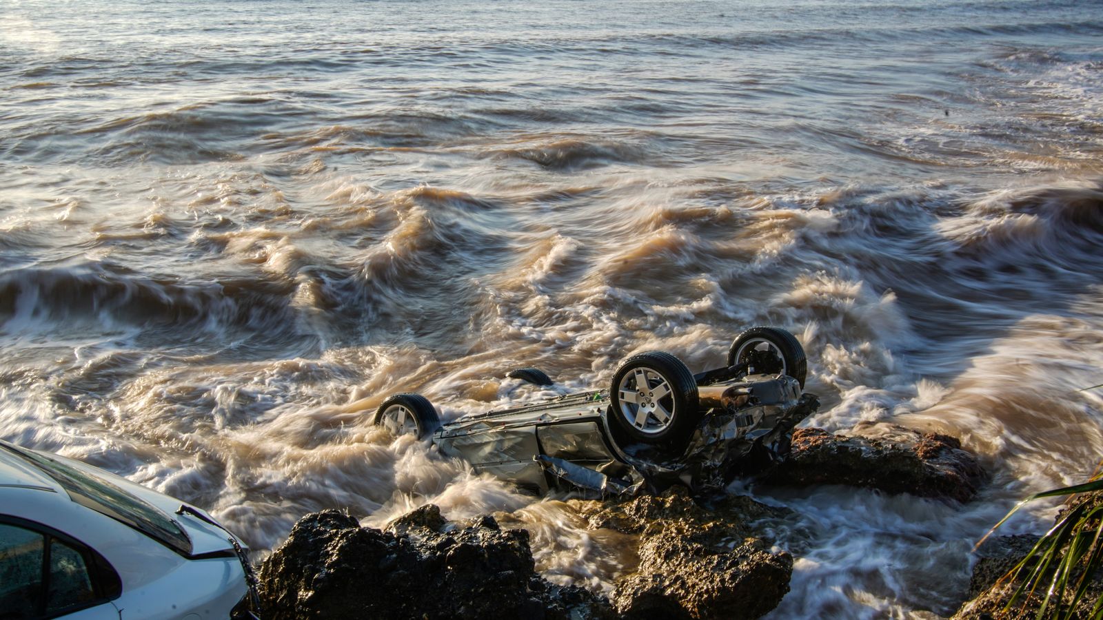 Spain: Intense flooding sees cars swept into Mediterranean Sea and ...