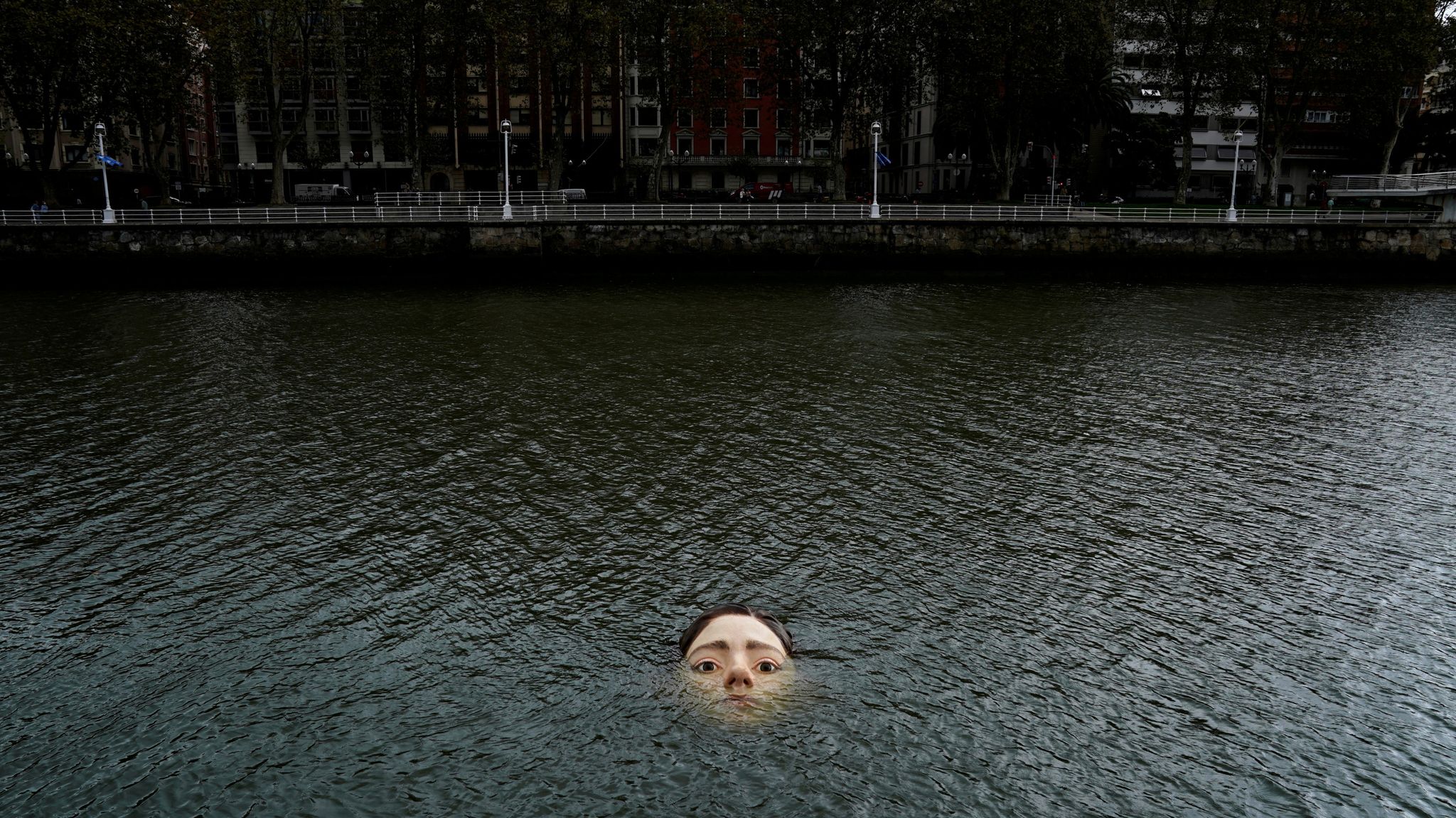 Eerie drowning girl statue in Bilbao river aims to encourage debate ...