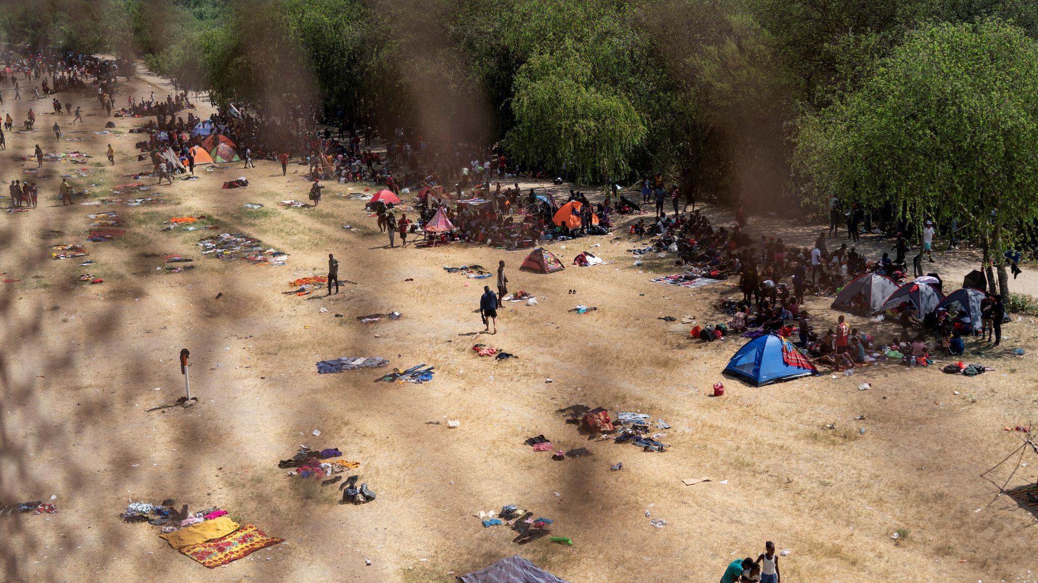 Texas begs for help as 10,000 migrants camp in squalid conditions under US-Mexico bridge | US ...