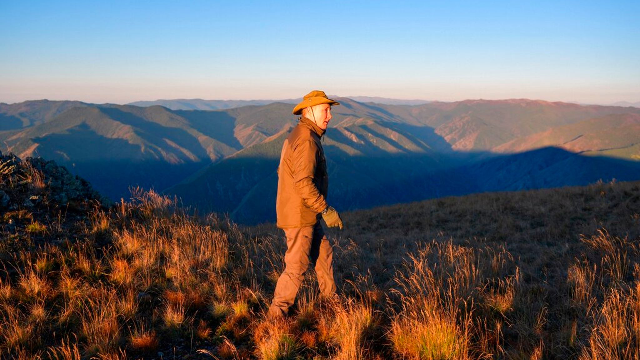 Vladimir Putin pictured fishing and hiking on Siberian forest holiday ...