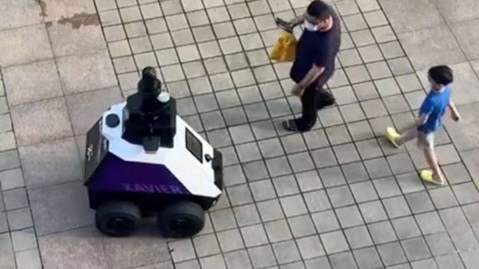 Robot policing 'uncivil behaviour' patrols streets of Singapore ...