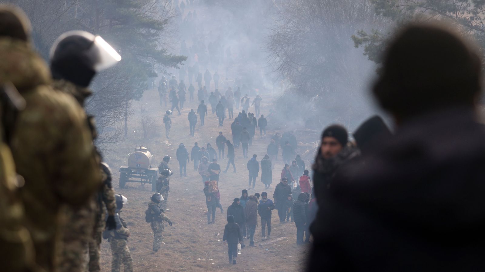 Migrants spotted and aided by Lithuanian guards | World News | Sky News