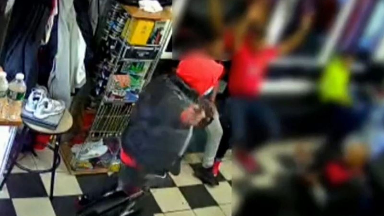 Video: CCTV shows armed suspect firing gun during robbery at barbershop ...