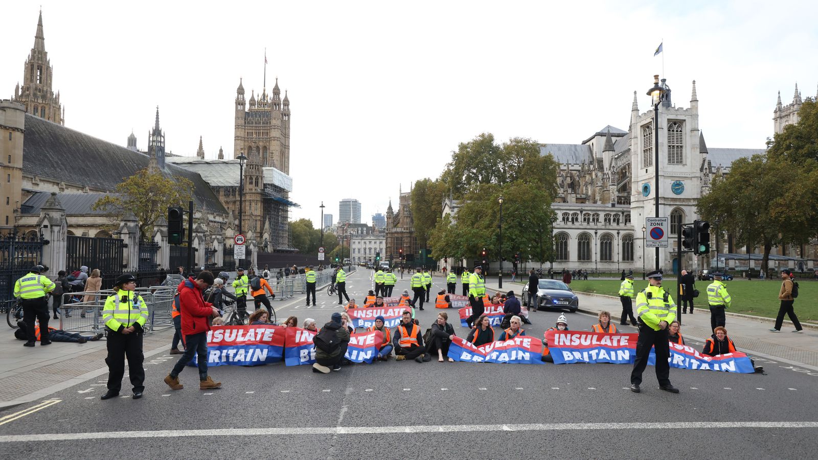 Insulate Britain protesters glue themselves to roads outside Parliament ...