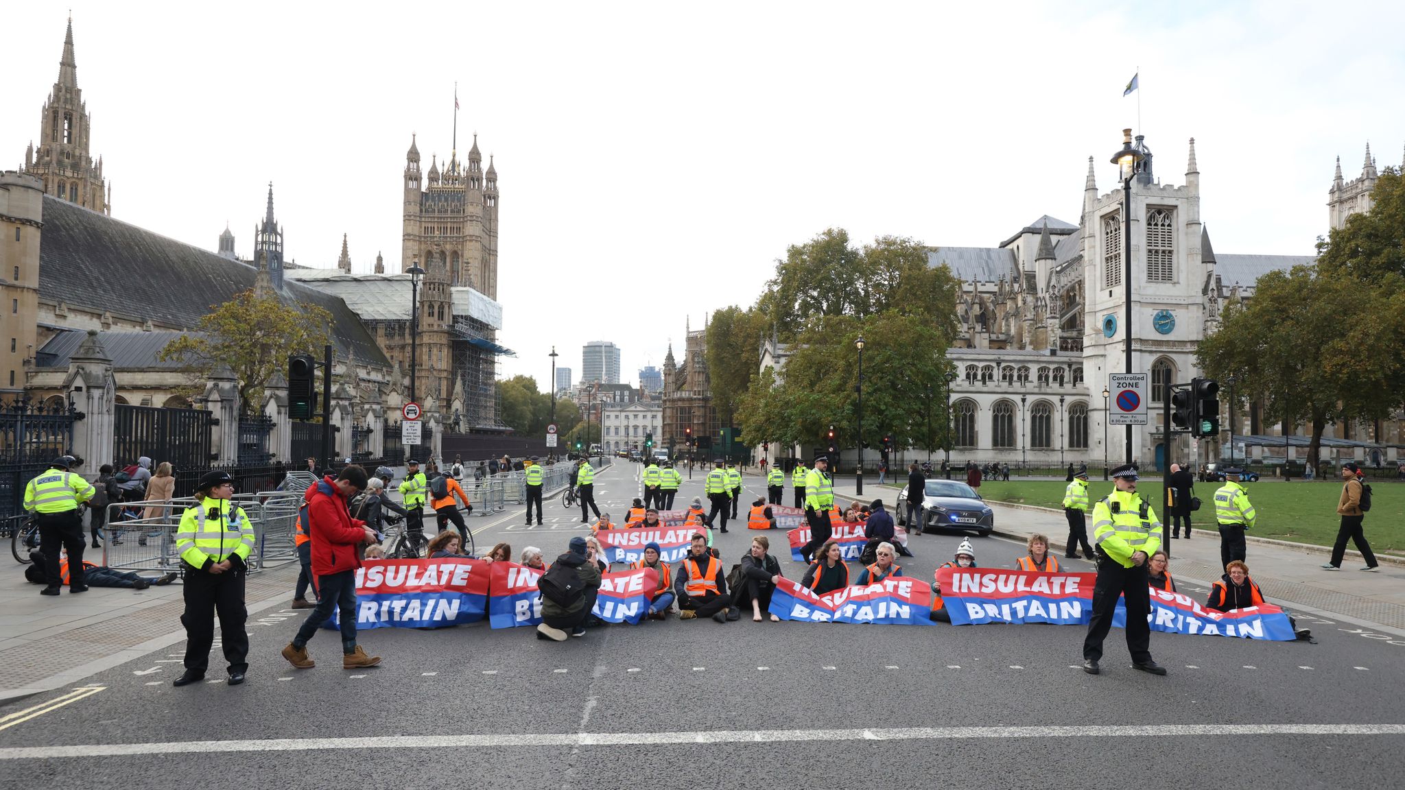 Insulate Britain protesters glue themselves to roads outside Parliament ...