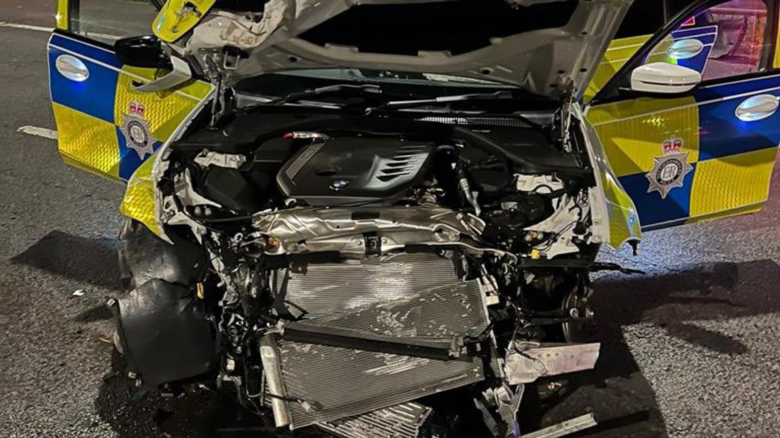 Police cars 'rammed by van' in motorway chase leaving two officers ...