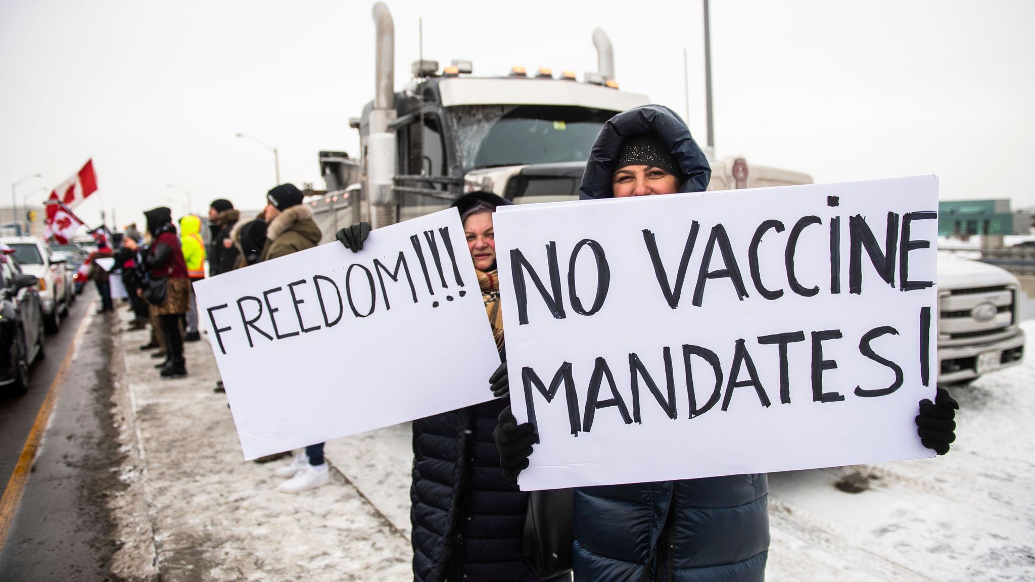 Truckers in Canada protest COVID mandate as some demonstrators dance on ...
