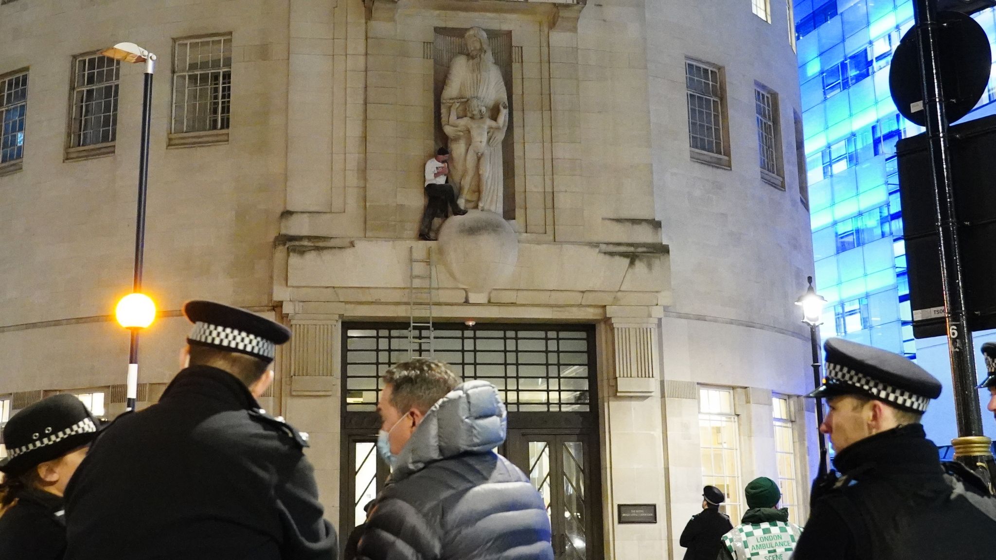 Man scales central London BBC building to attack controversial statue ...
