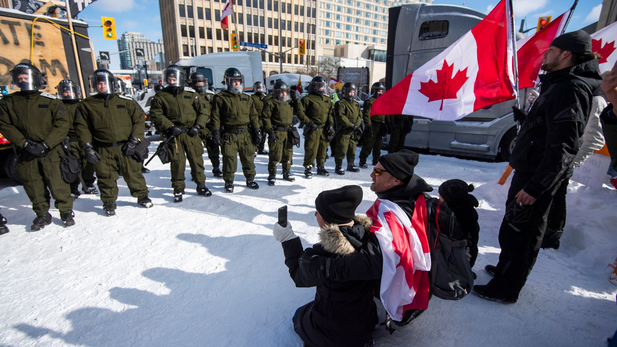 Freedom Convoy: At least 100 people arrested as police move to control ...