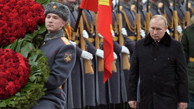 Russian President Vladimir Putin takes part in a wreath laying ceremony ...