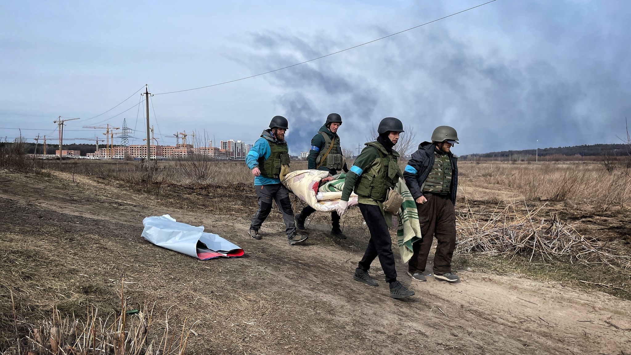 Ukraine war: Bodies stretchered across escape route as Russian troops ...