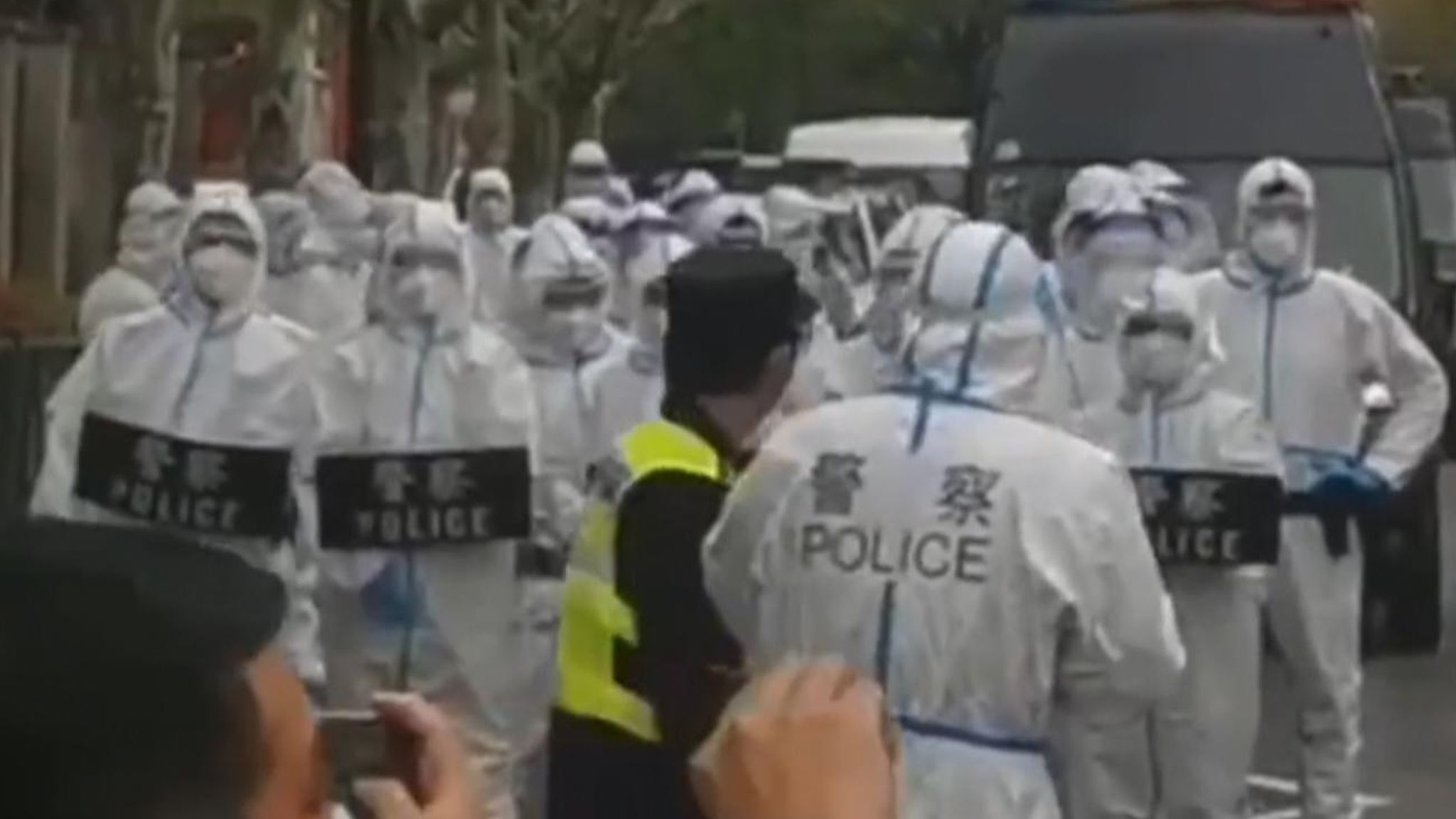 Shanghai: Police in hazmat suits push back COVID protesters angry at ...