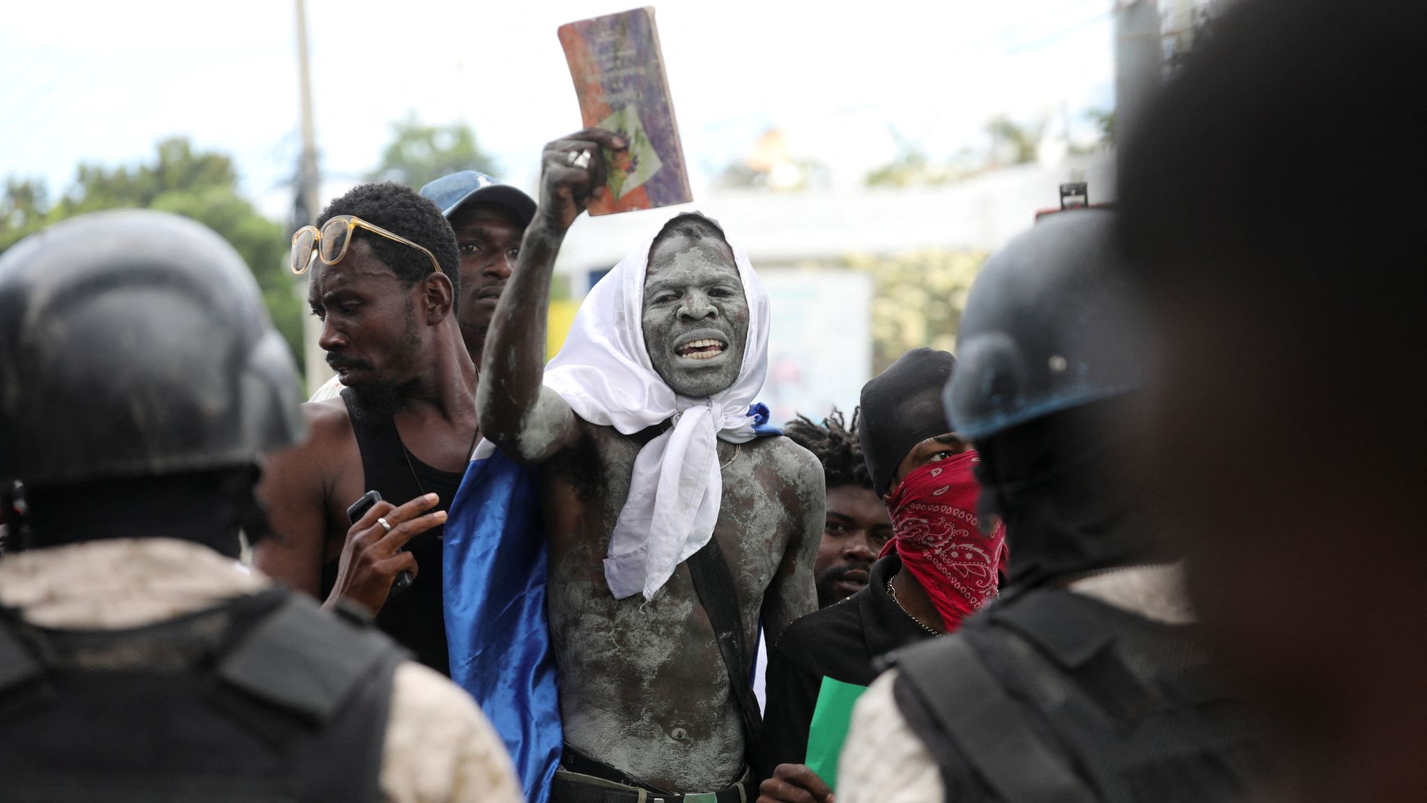 Haiti gang fighting sees at least 20 die and thousands flee their homes ...