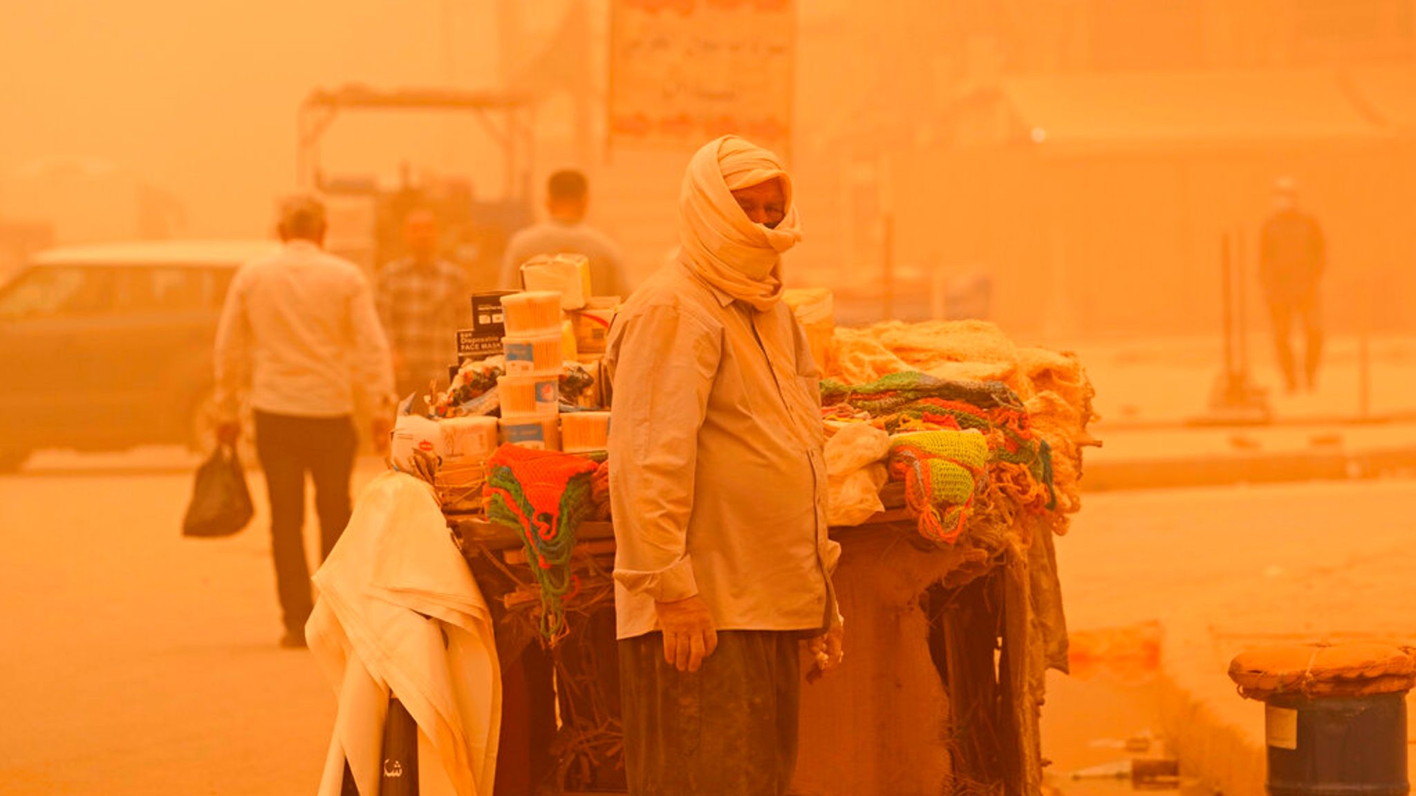 Flights disrupted and people told to stay at home as sandstorm sweeps ...