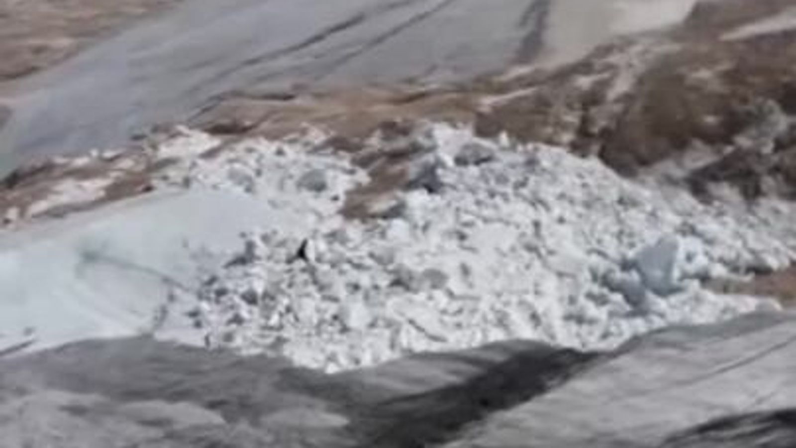 Video shot from a helicopter shows the partially collapsed glacier that ...