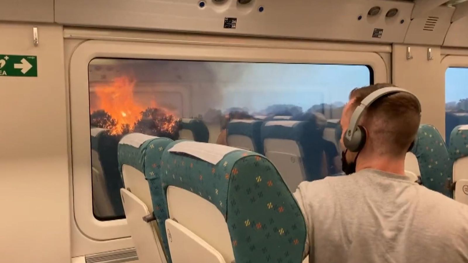 Train surrounded by wildfires in Spain during severe heatwave | World ...