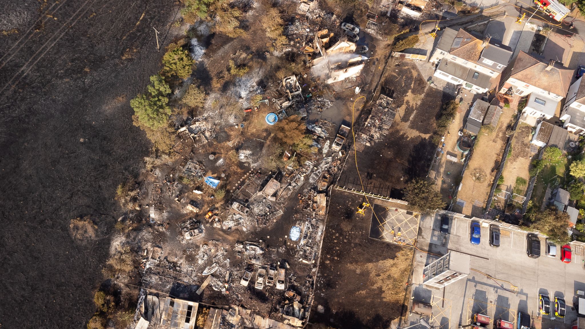 UK's hottest-ever day leaves charred remains of homes and cars - and ...