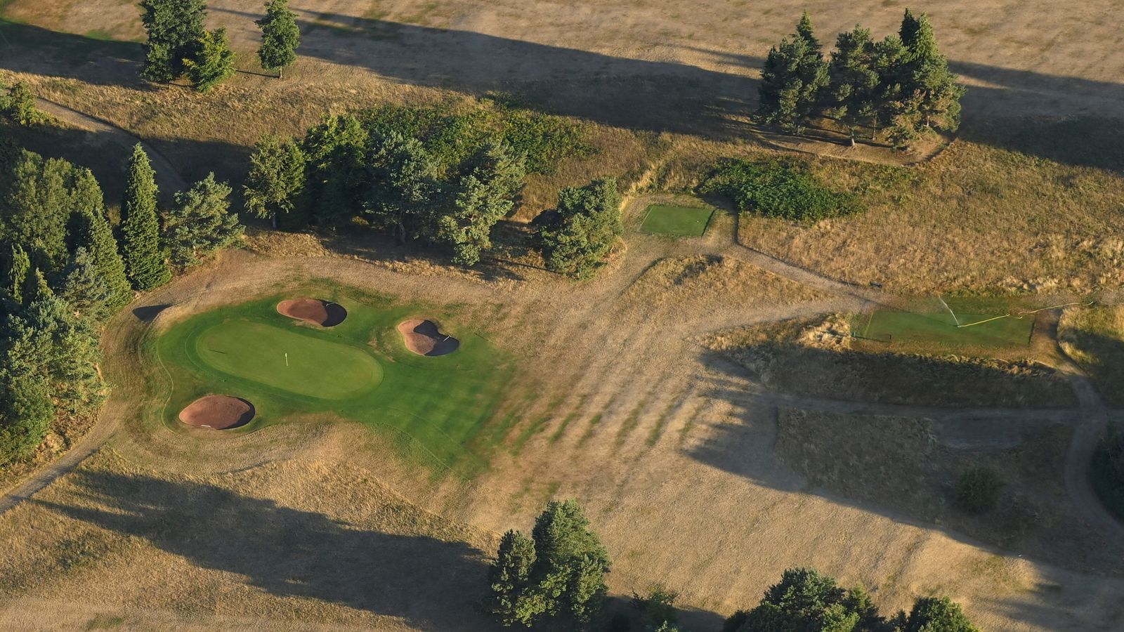 UK's extreme weather: Heat and fires in the south, storms and floods in ...