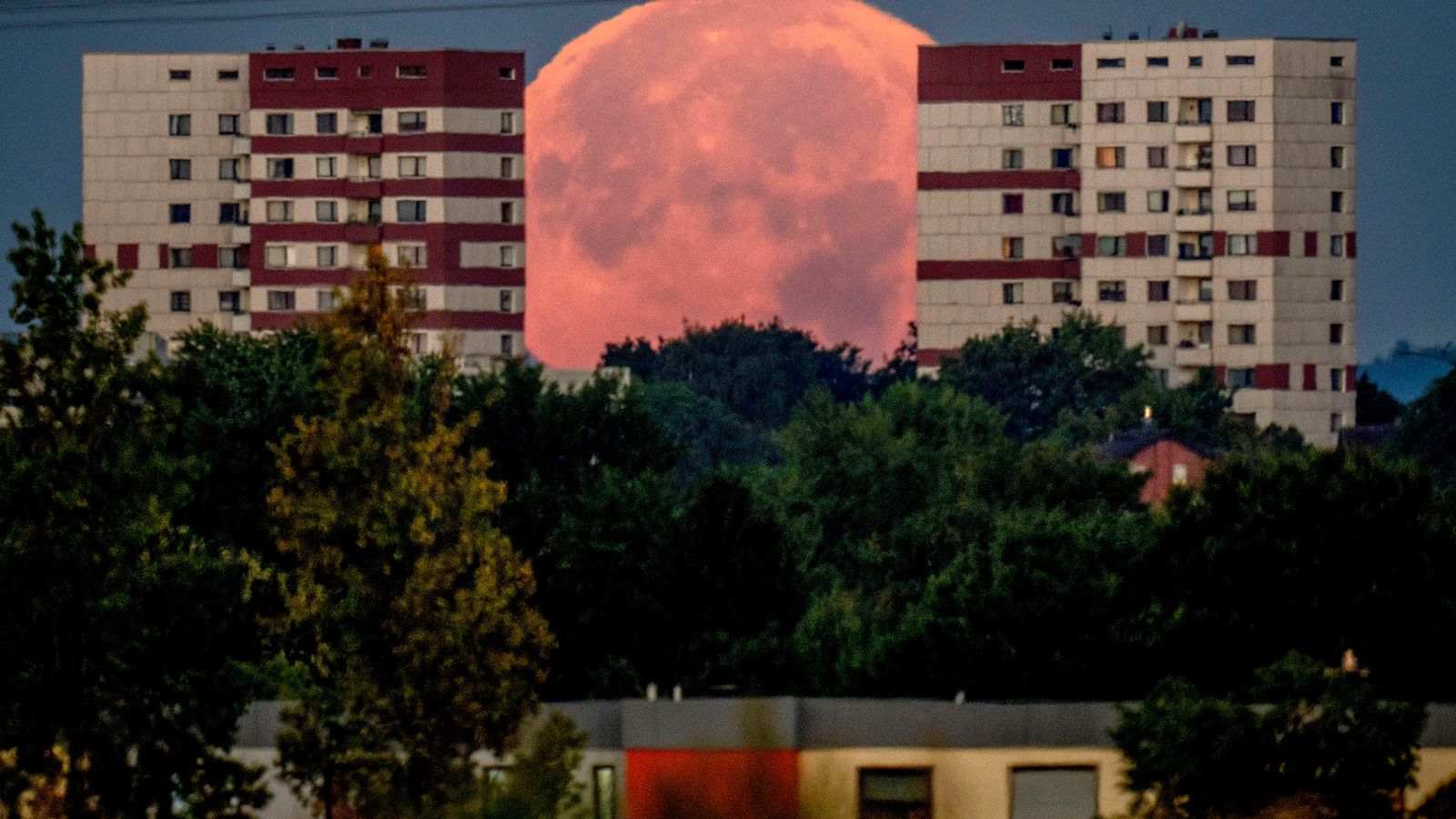 In pictures: Glowing supermoon delights stargazers across the UK and ...