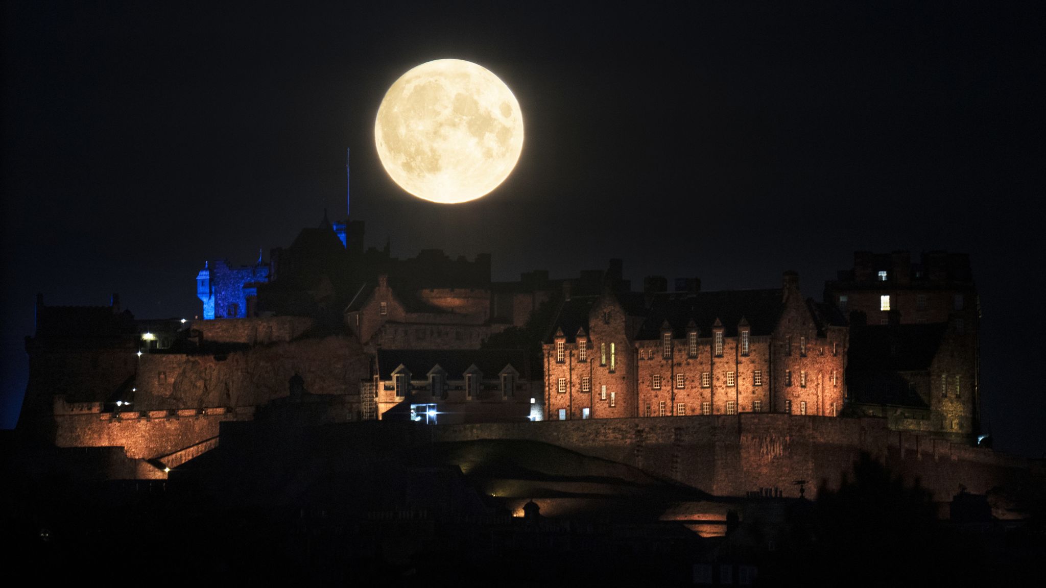 In pictures: Glowing supermoon delights stargazers across the UK and ...