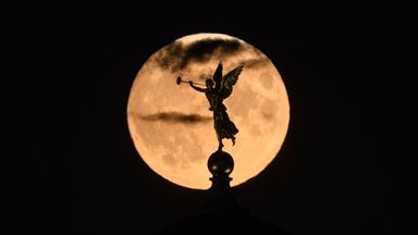 In pictures: Glowing supermoon delights stargazers across the UK and ...